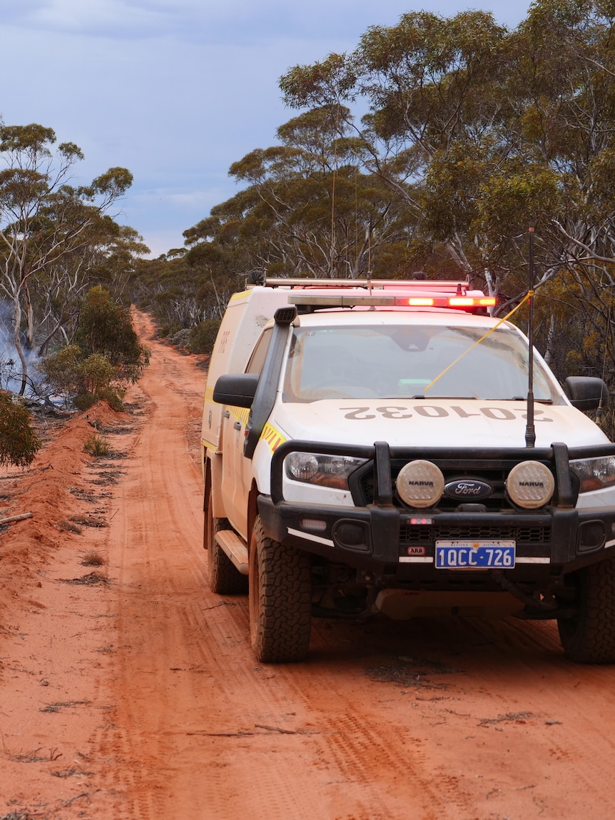 Rain dampens bushfire threatening key highway as storms batter outback ...